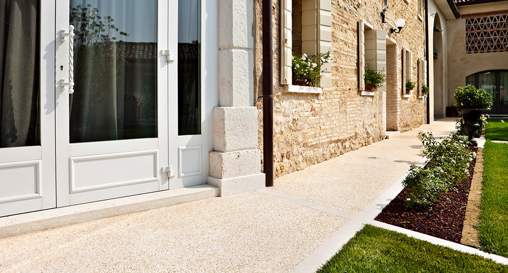 Exposed crushed or washed aggregate paving or precast pebble slabs ...