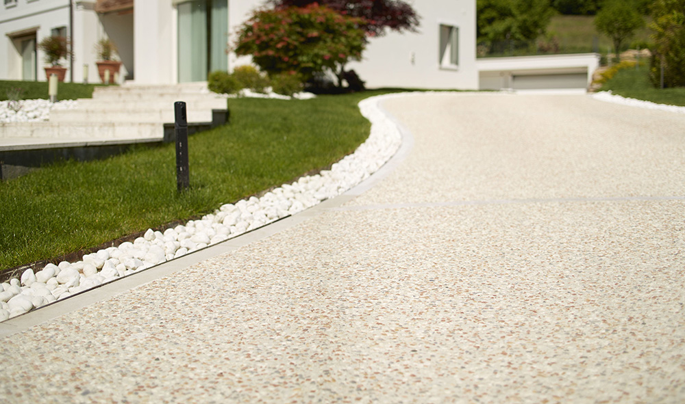 Exposed crushed or washed aggregate paving or precast pebble slabs ...